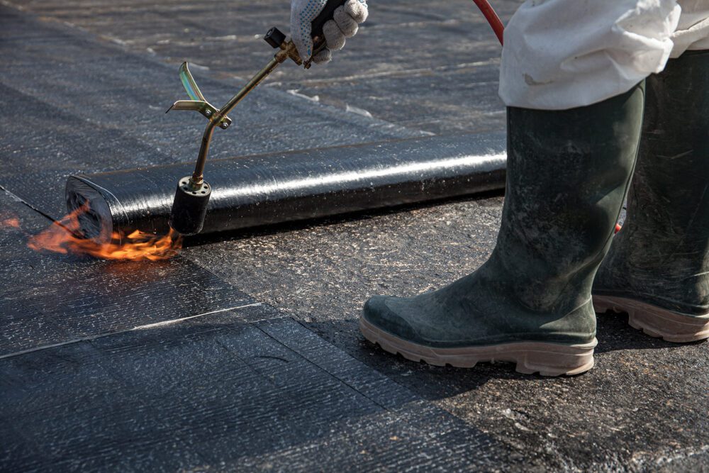 What is a Commercial Flat Roof Tear-Off and Do You Need One? - IKO