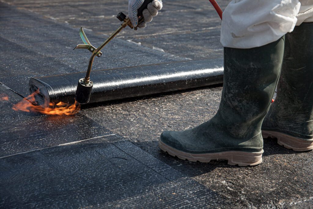 What is a Commercial Flat Roof Tear-Off and Do You Need One? - IKO